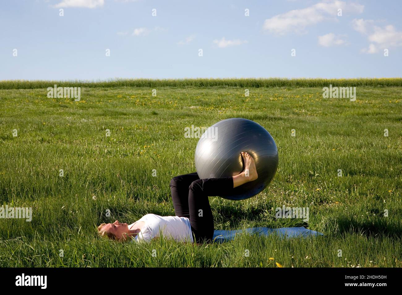 Woman lying on back sit ups hi-res stock photography and images - Alamy