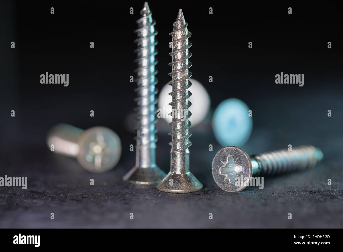 Macro photo of Screws - selective focus, shallow depth of field, dark ...
