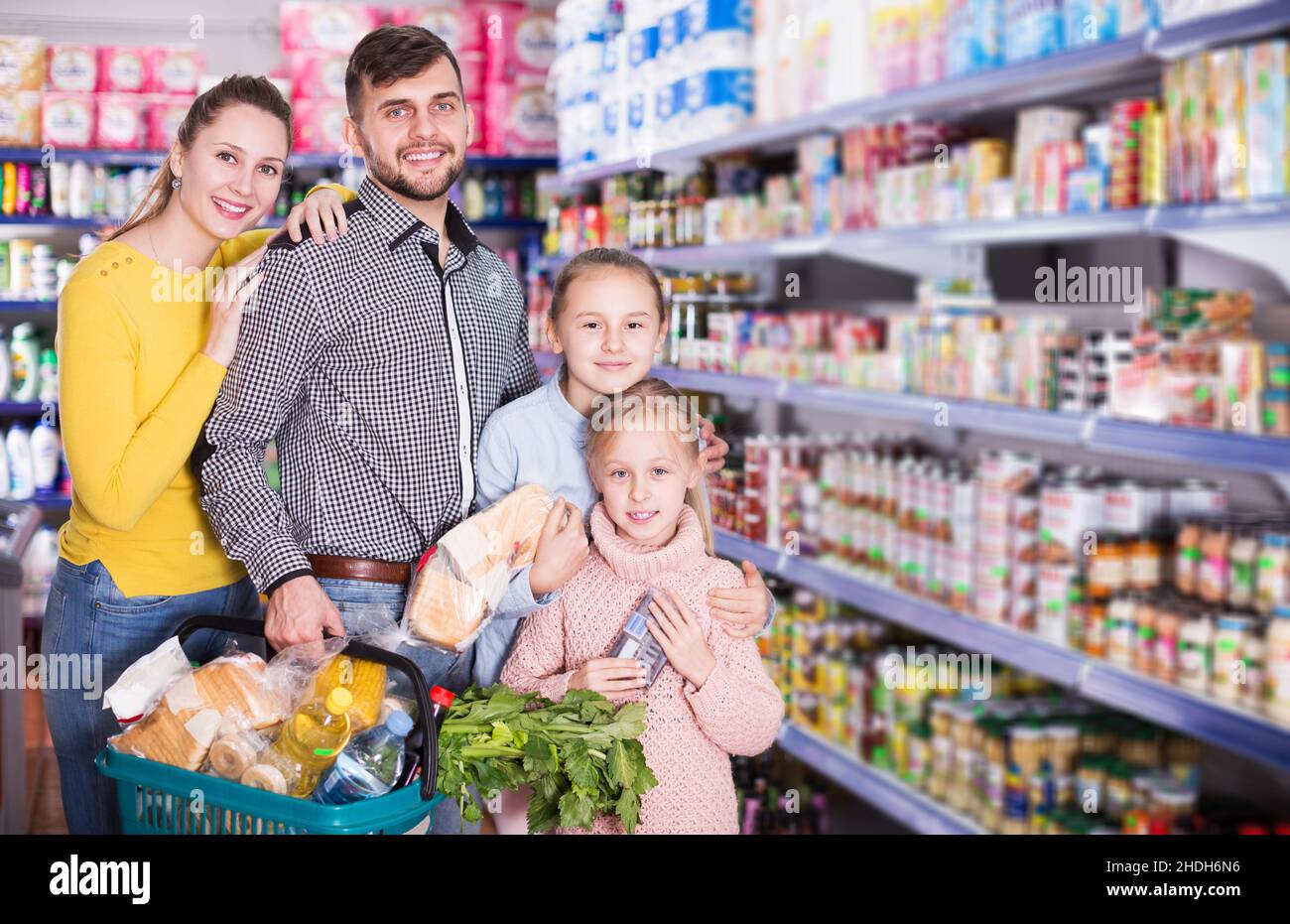 parents with girls with purchases during family shopping Stock Photo ...