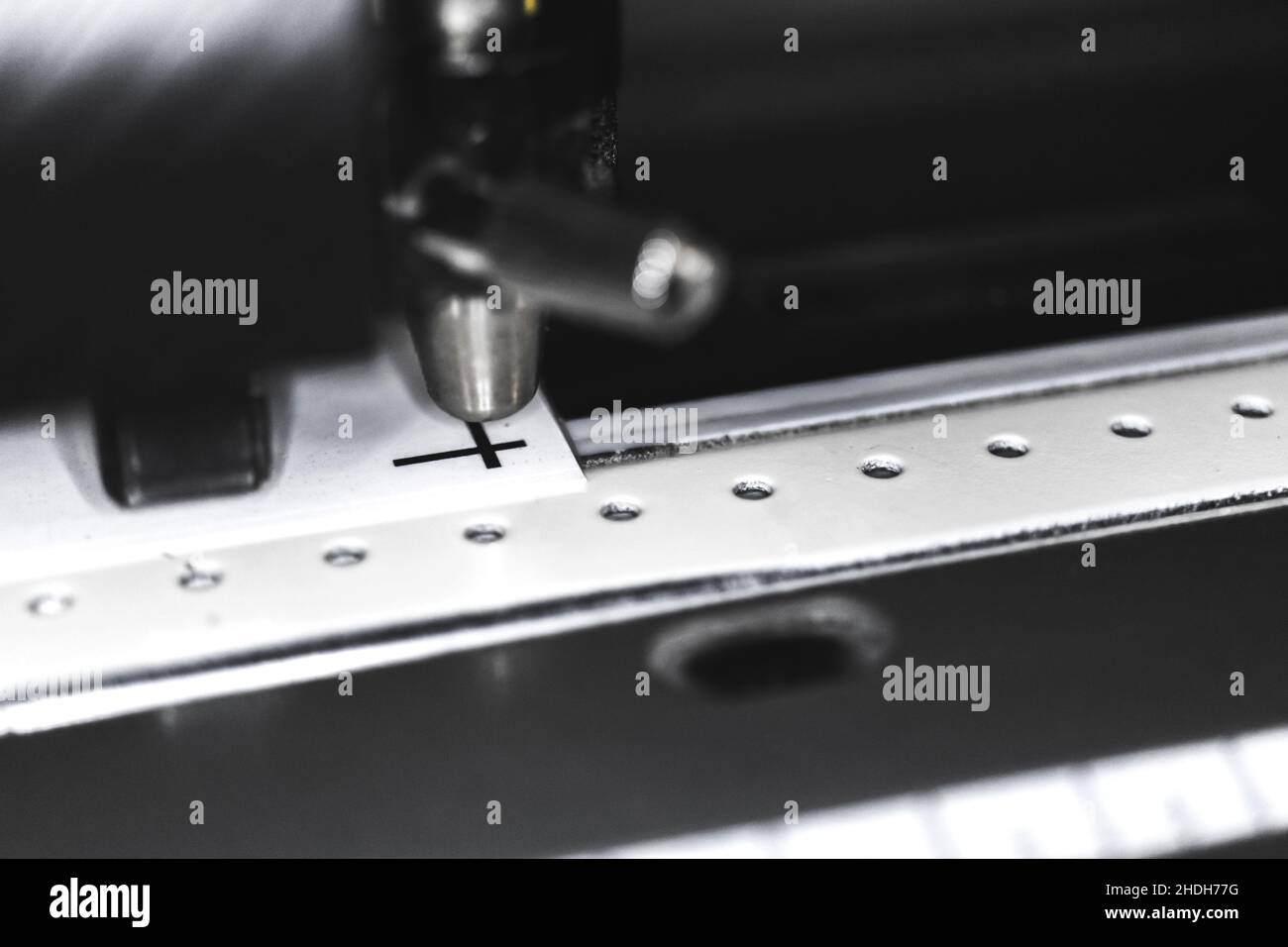 Modern plotter laser cutter machine in print house industry, close-up ...