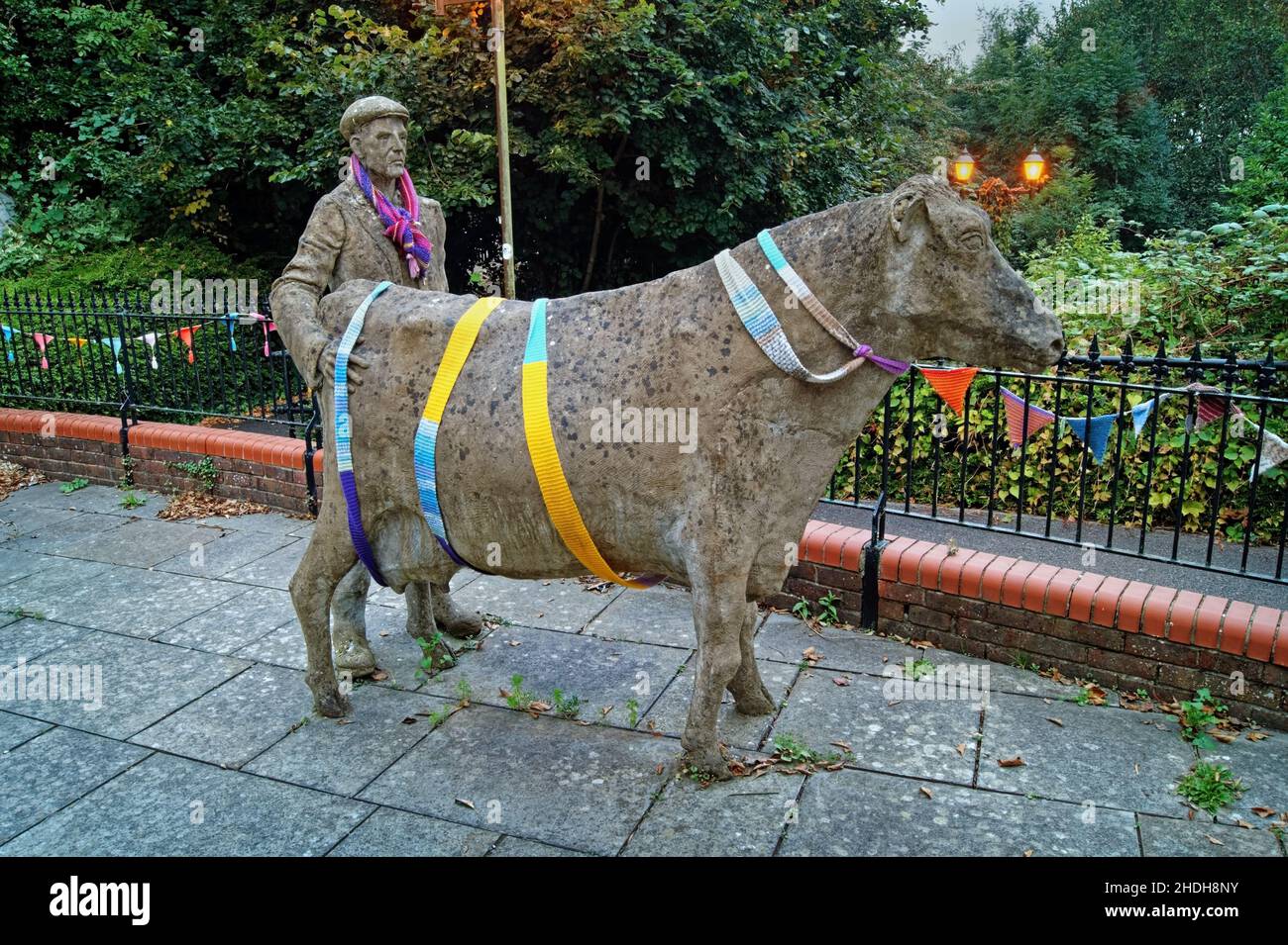 UK, Devon, Axminster, Farmer Fred and Bella the Cow Statue Stock Photo ...