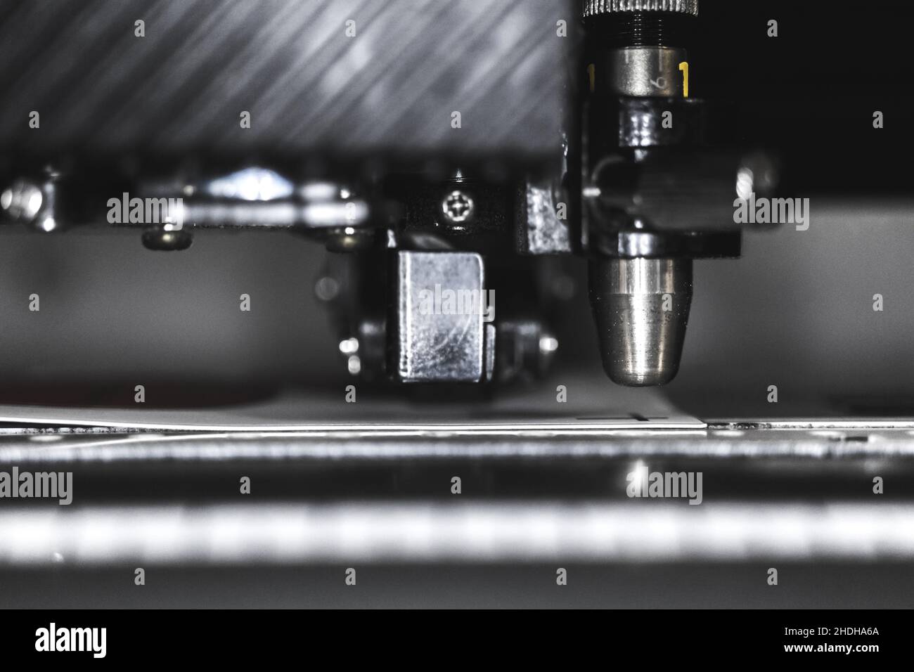 Modern plotter laser cutter machine in print house industry, close-up ...