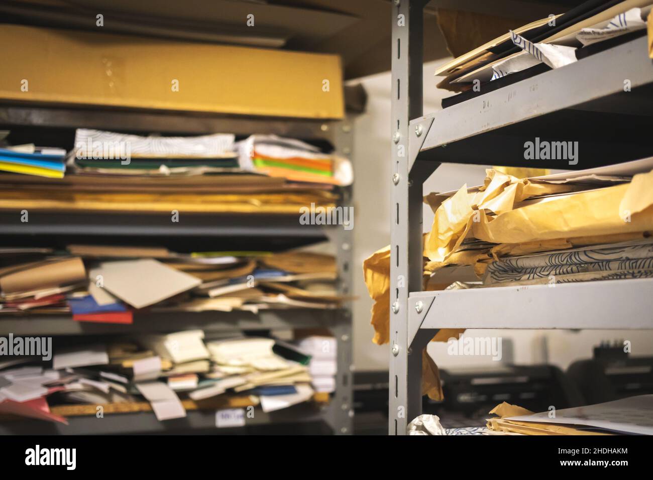 Printing house warehouse and metal shelf with different type of paper ...