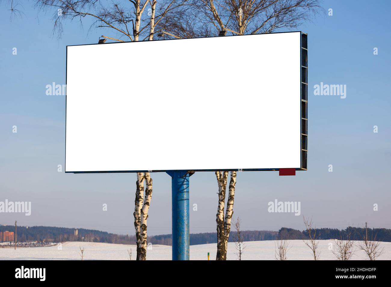 white billboard along the highway on a winter snow day. Background for ...
