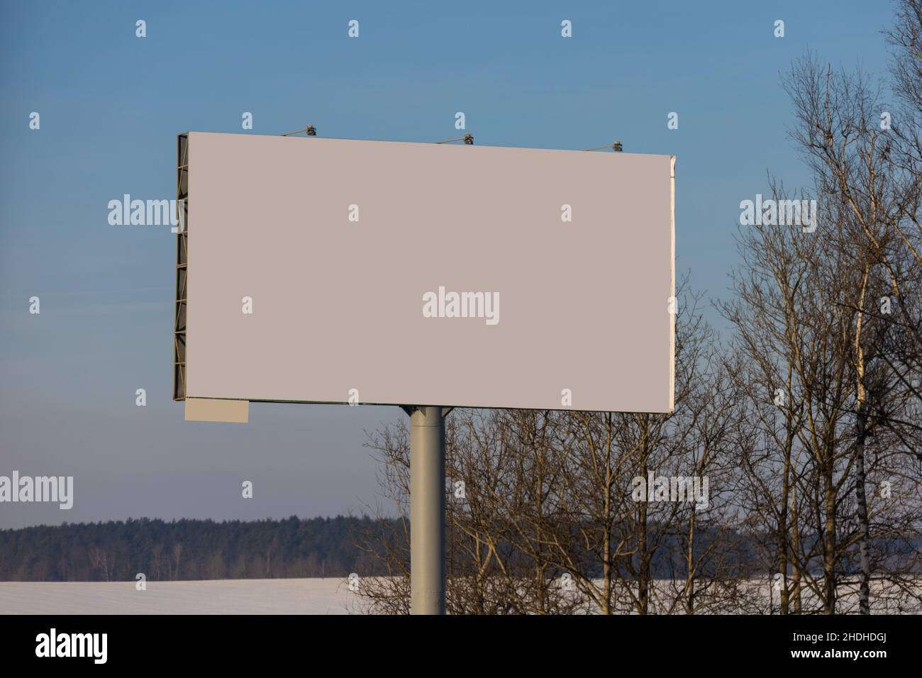 white billboard along the highway on a winter snow day. Background for ...
