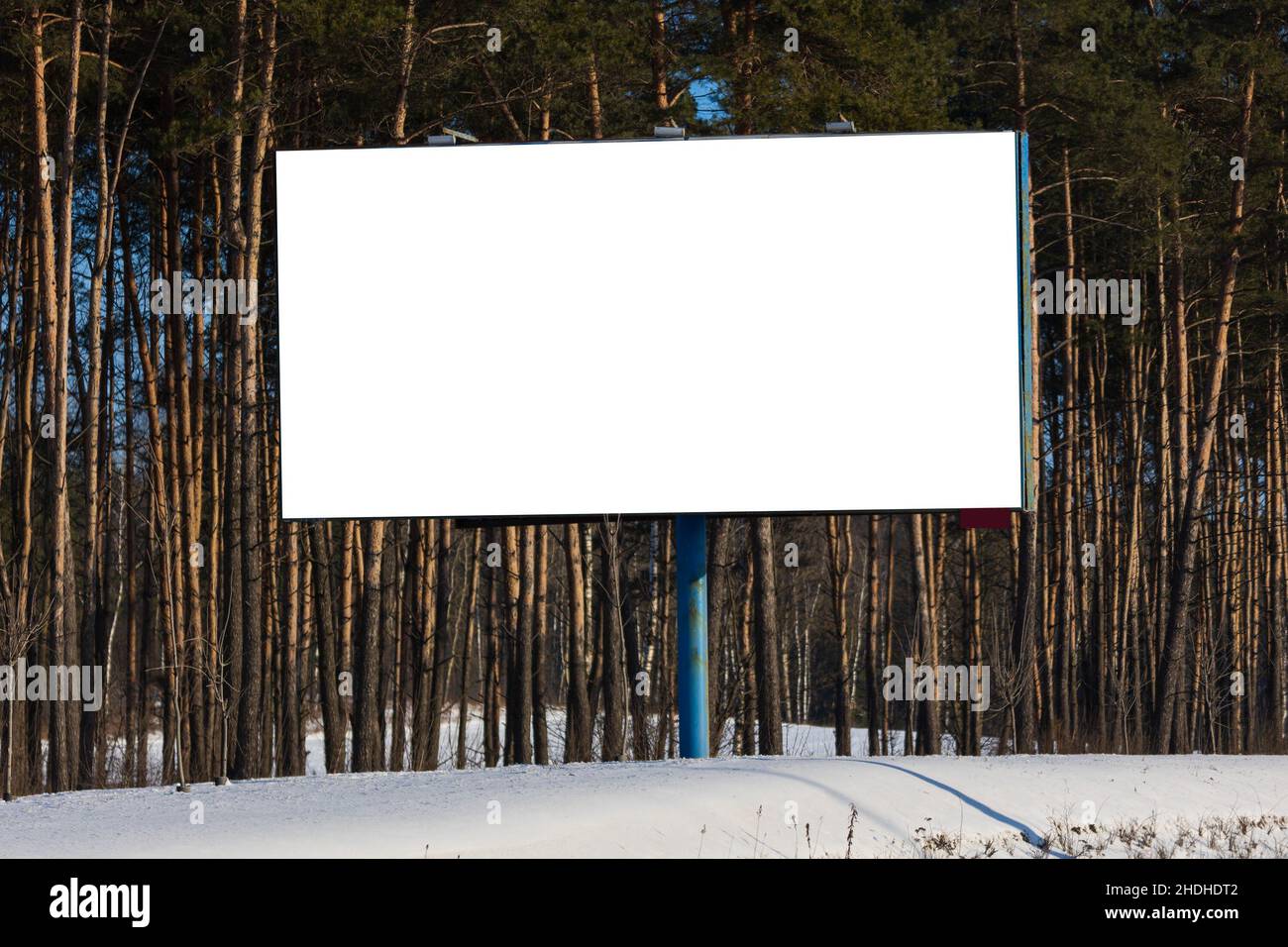white billboard along the highway on a winter snow day. Background for ...