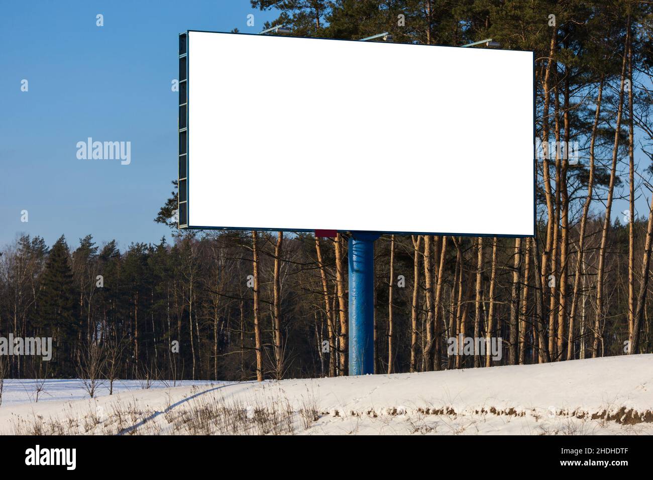 white billboard along the highway on a winter snow day. Background for ...