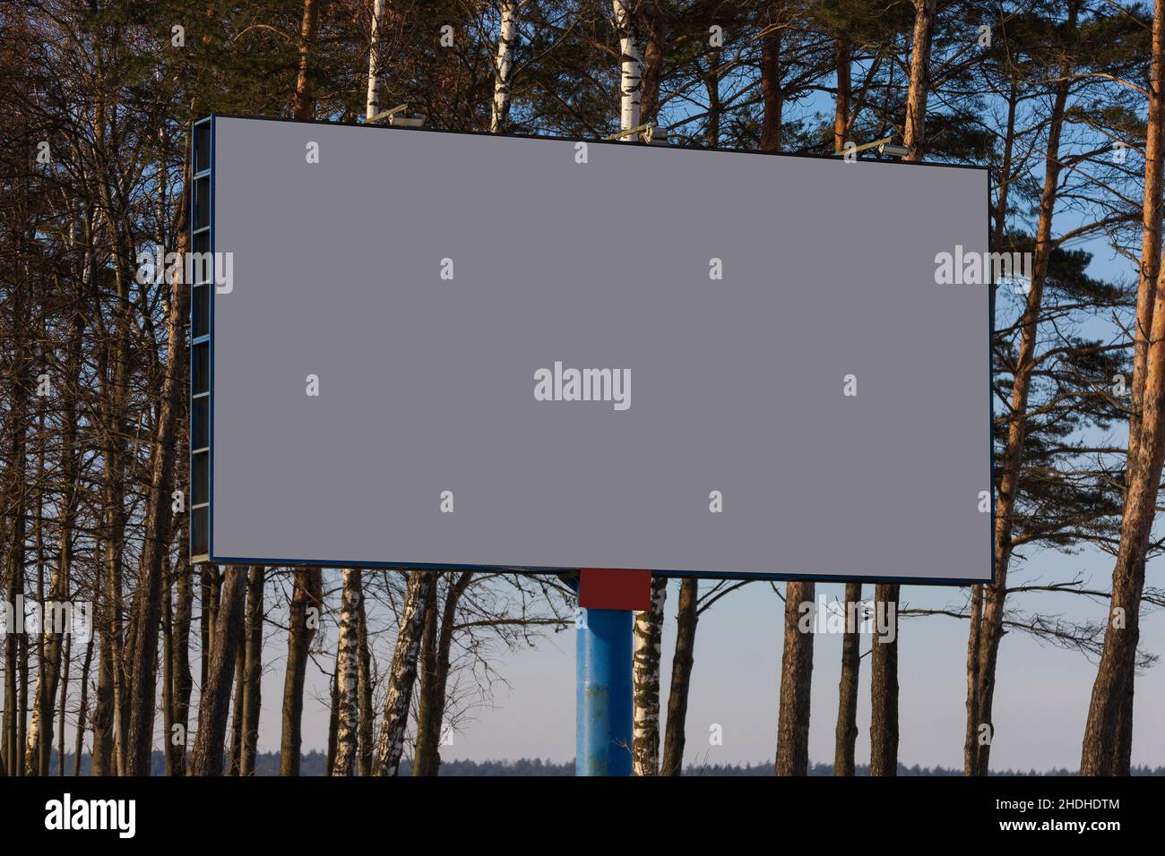 white billboard along the highway on a winter snow day. Background for ...