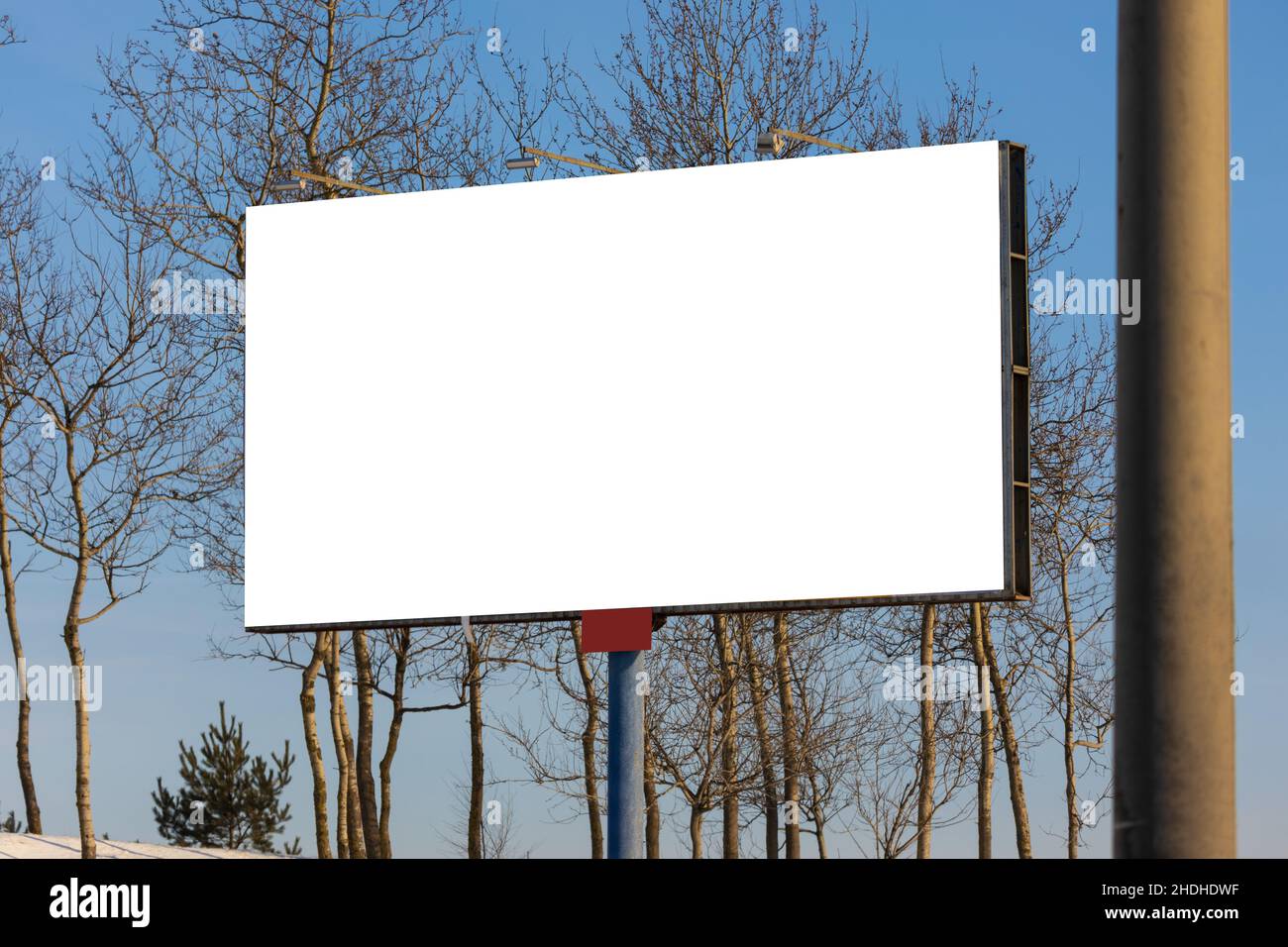 white billboard along the highway on a winter snow day. Background for ...