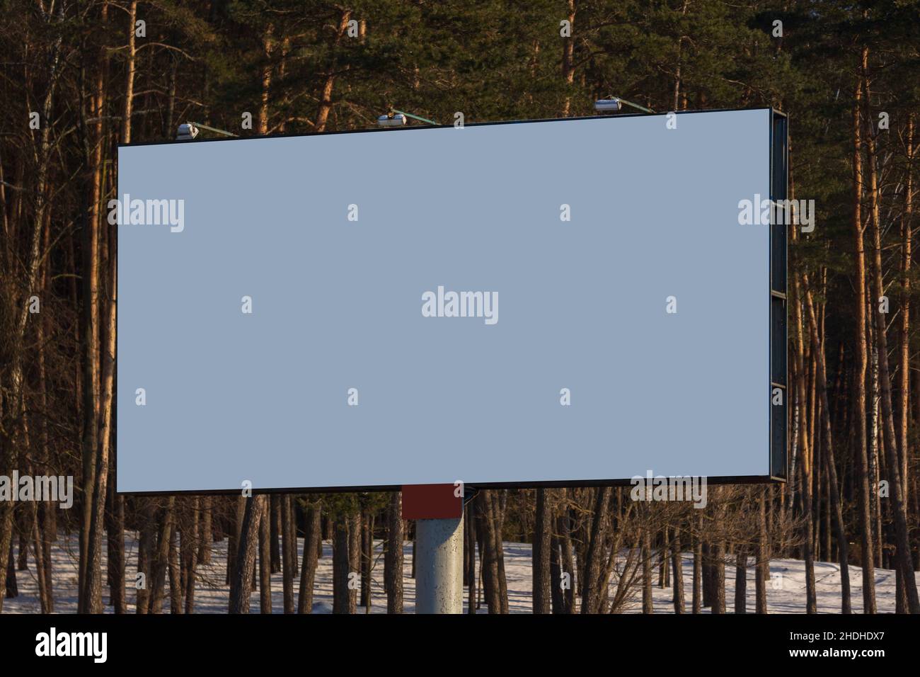 white billboard along the highway on a winter snow day. Background for ...