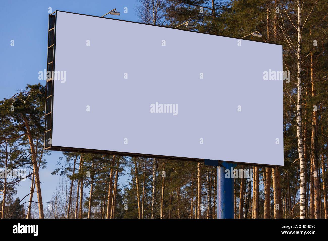 white billboard along the highway on a winter snow day. Background for ...