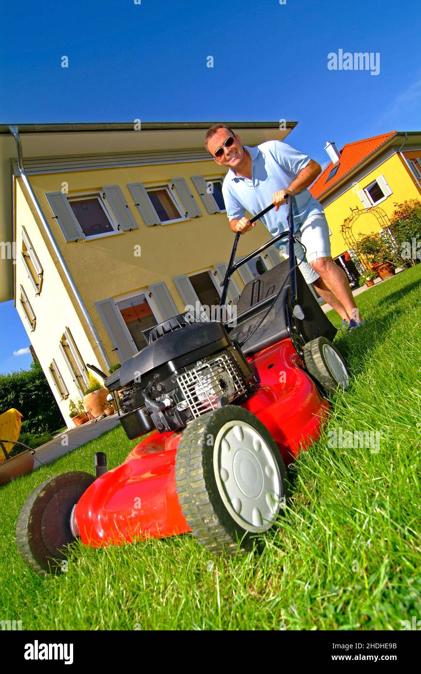 mowing, lawn mower, lawn mowers Stock Photo - Alamy