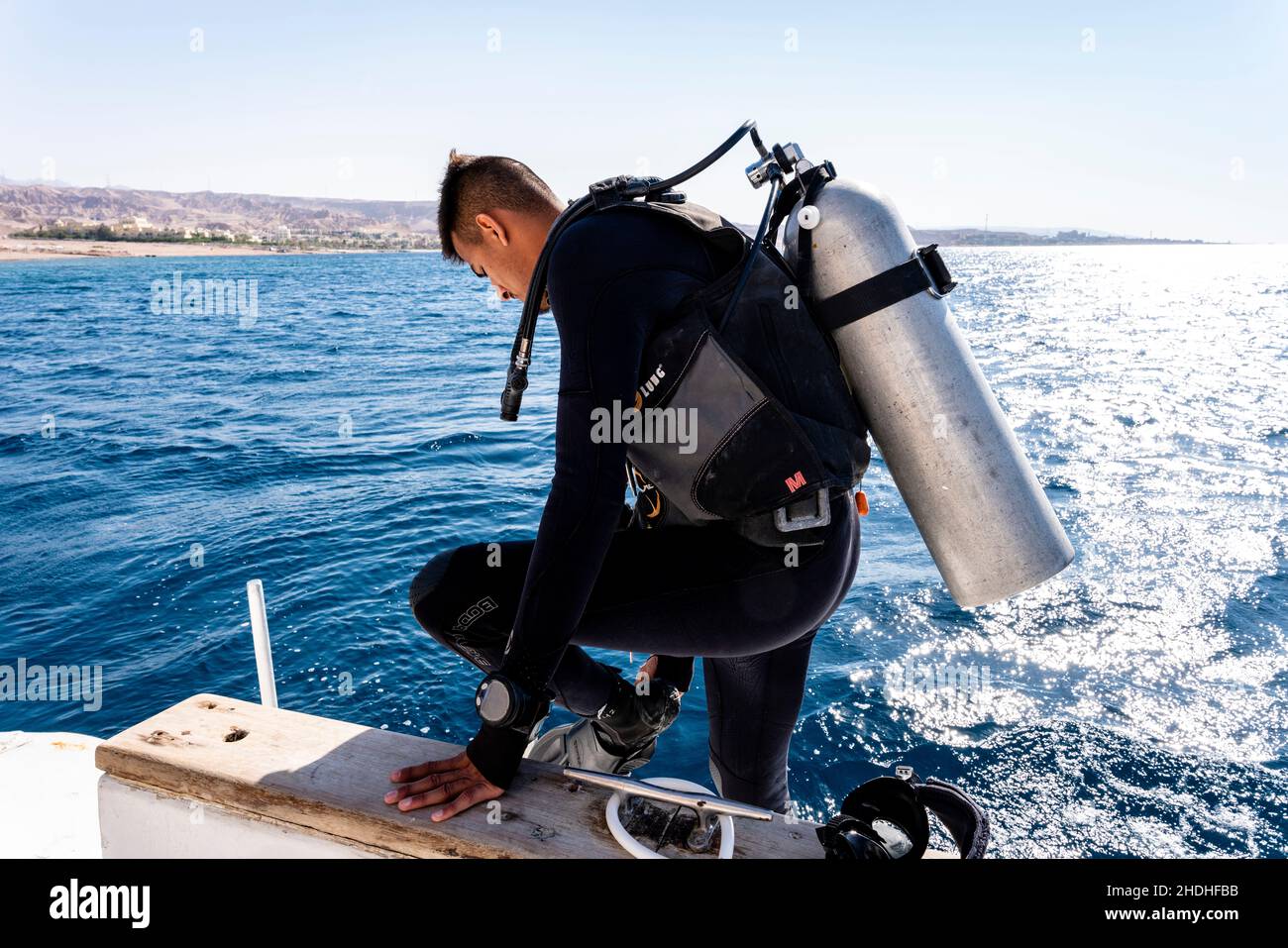 A Diver Preparing To Dive In The Red Sea, Aqaba, Aqaba Governorate ...