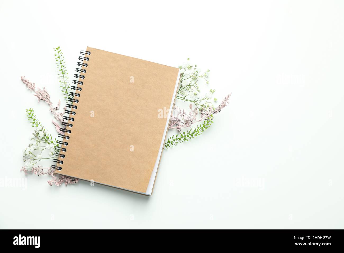 Blank notebook with flowers on white background Stock Photo - Alamy