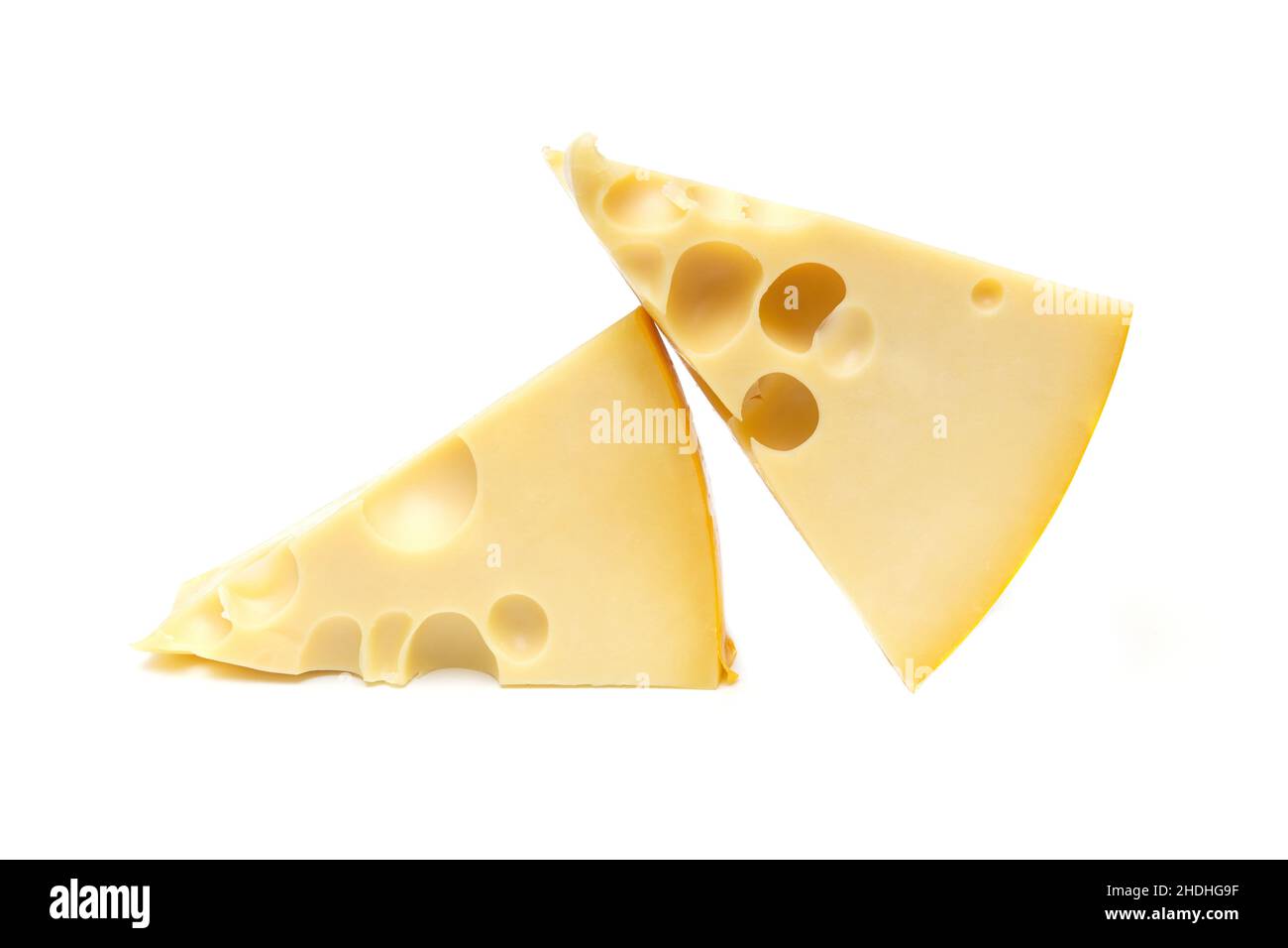 Two wedge shaped chunks of cheese with big holes isolated on white ...