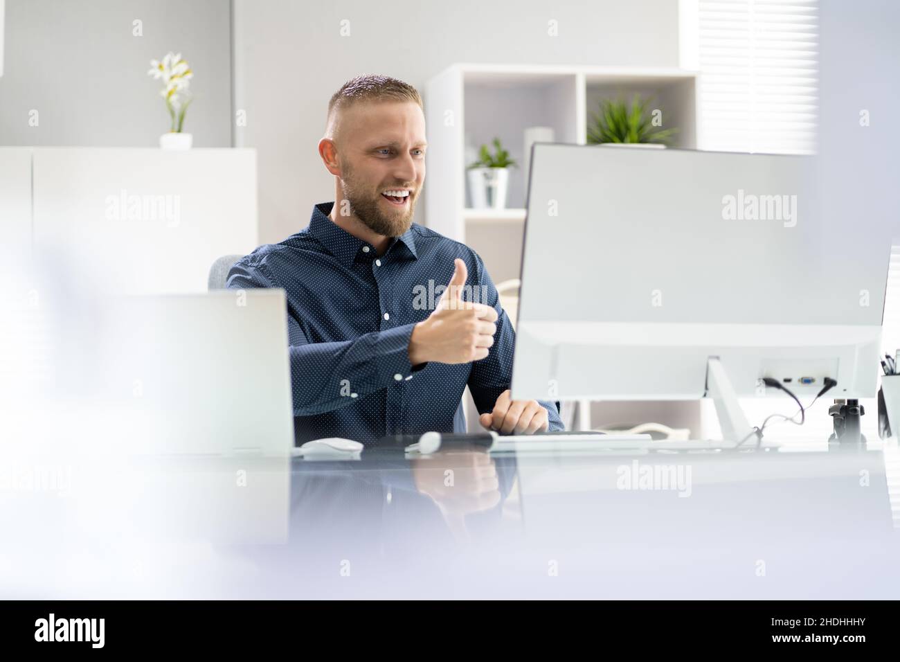 Happy young man video call hi-res stock photography and images - Alamy