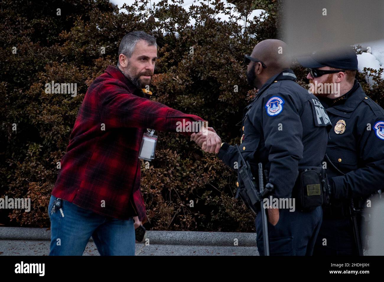 Former Washington DC Metro police officer Michael Fanone, left, greets ...