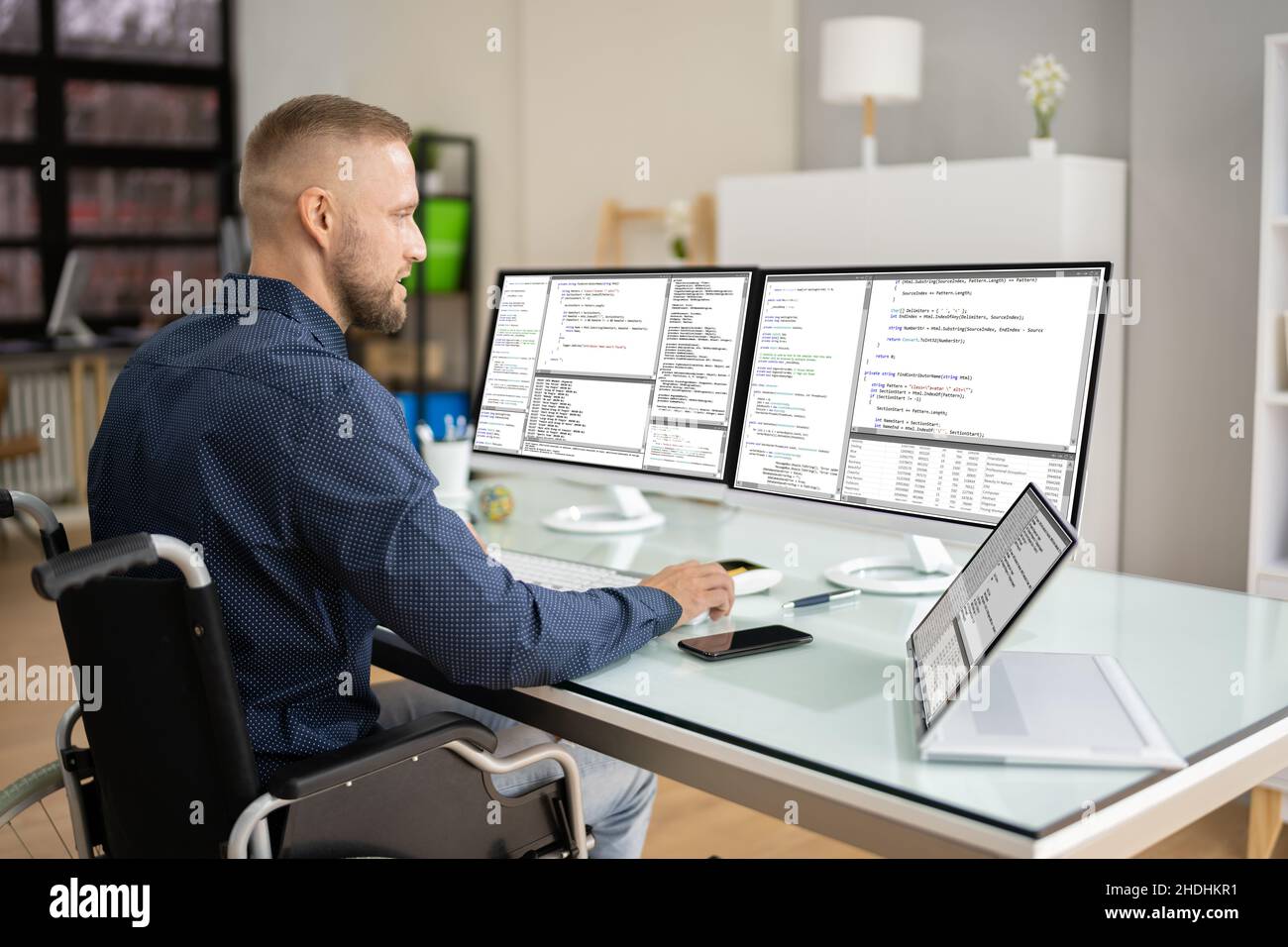 Coder In Wheelchair Using Computer. People In Office Stock Photo - Alamy