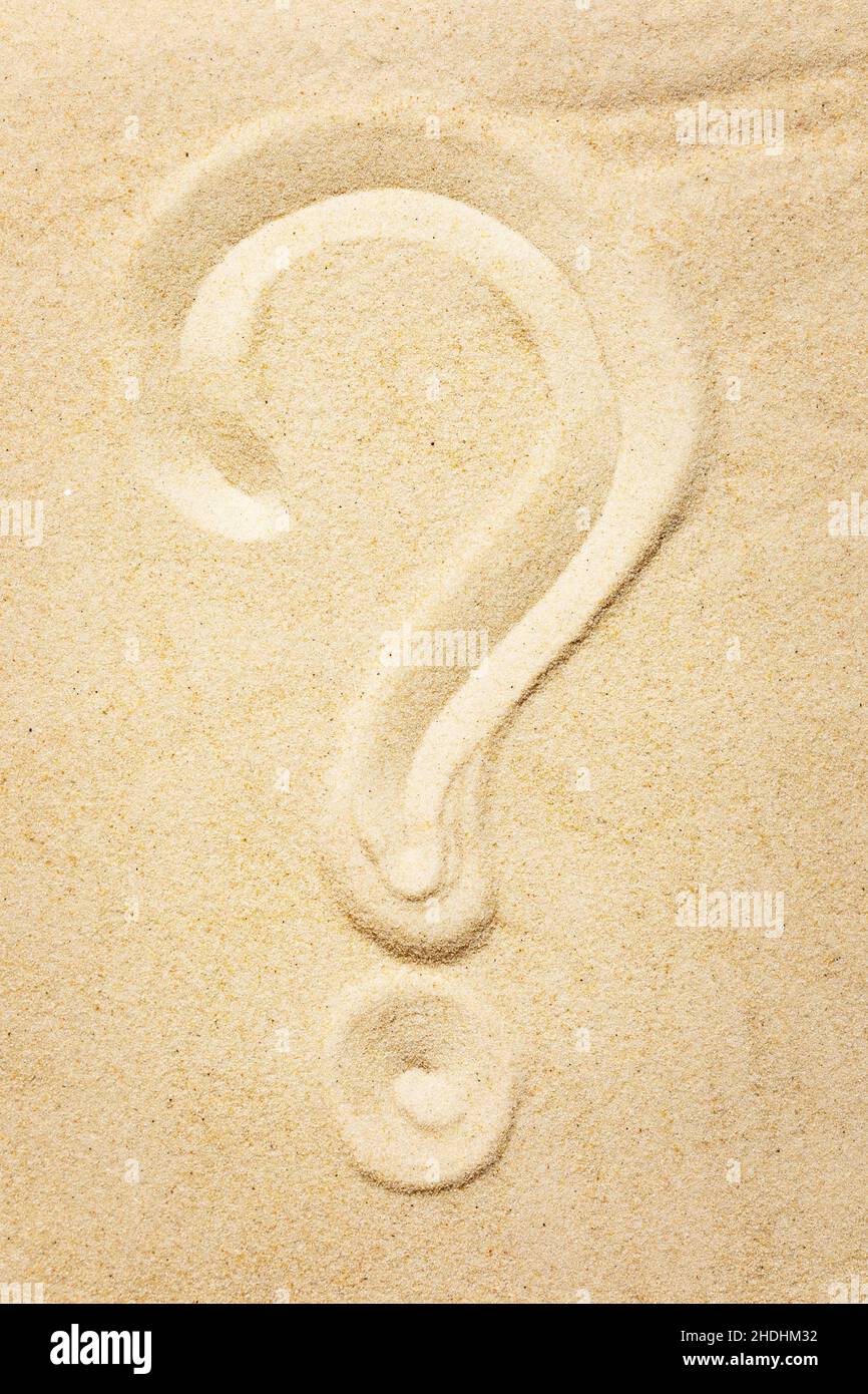 A question mark painted on the beach sand. The concept of opening a ...