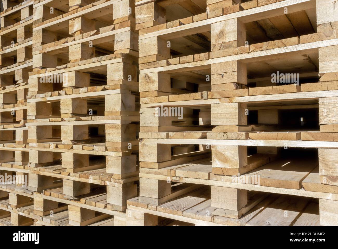 Stacked wooden pallets at a storage Stock Photo - Alamy