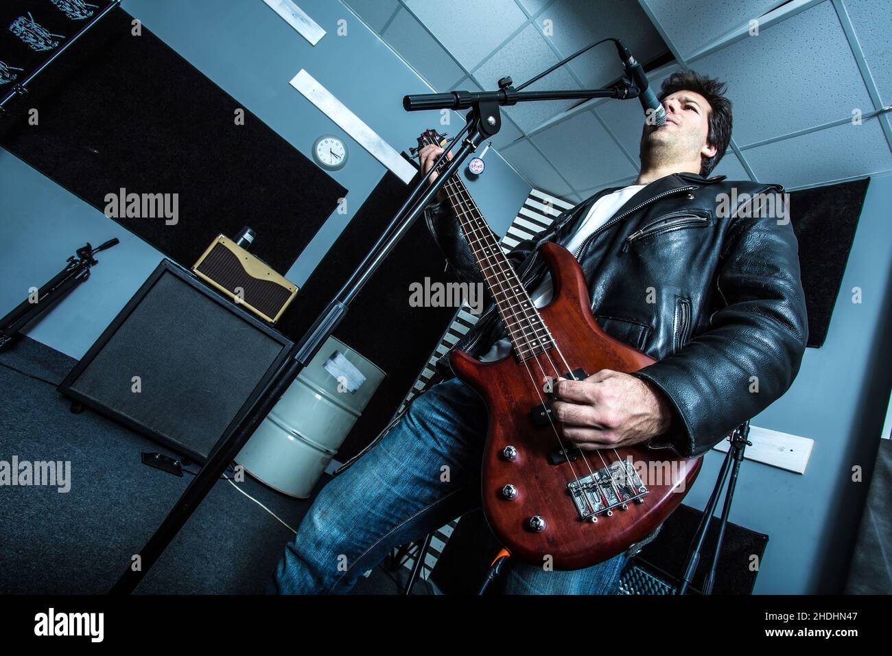 Man playing bass guitar room hi-res stock photography and images - Alamy