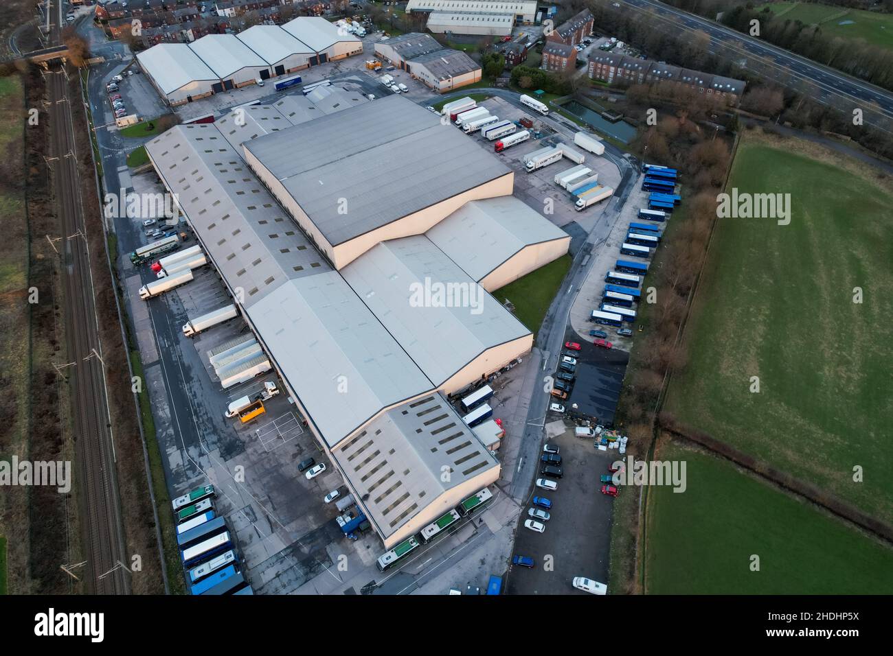 Aerial drone view of group of large modern industrial warehouse or ...