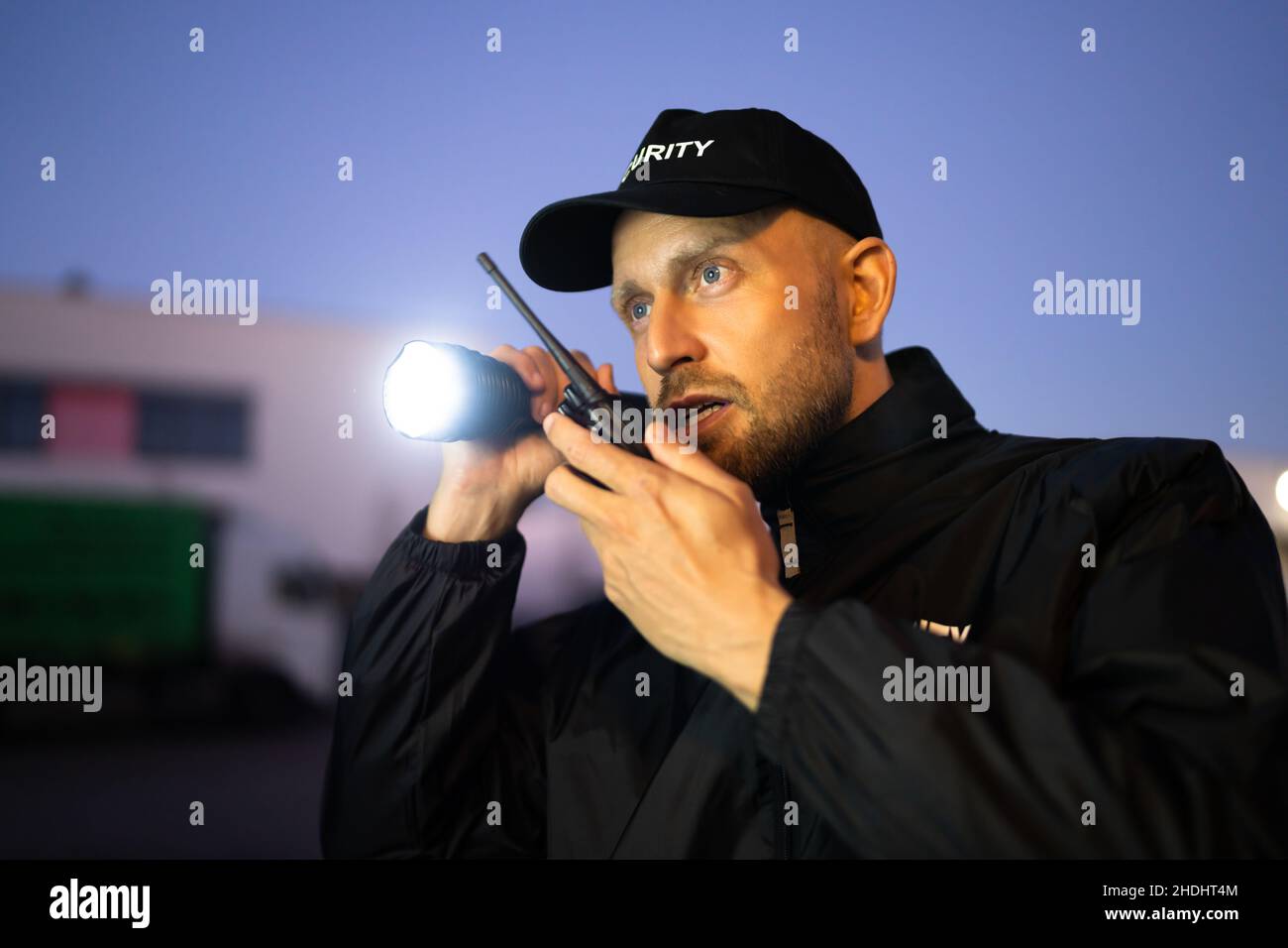 Security Guard Officer Using Walkie-Talkie Radio At Night Stock Photo ...