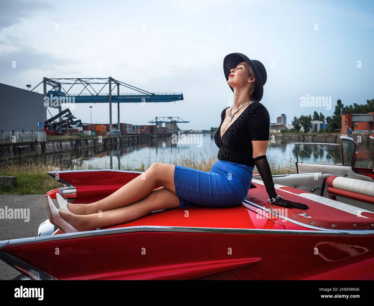Old-timer red Cadillac and a beautiful young girl. France Stock Photo ...