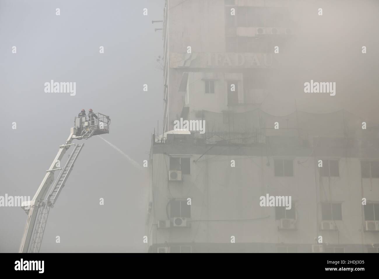 Dhaka, Bangladesh. 06th Jan, 2022. Firefighters try to douse the fire ...