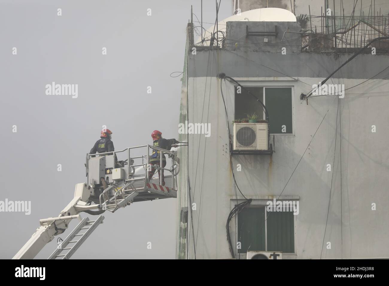 Dhaka, Bangladesh. 06th Jan, 2022. Firefighters try to douse the fire ...