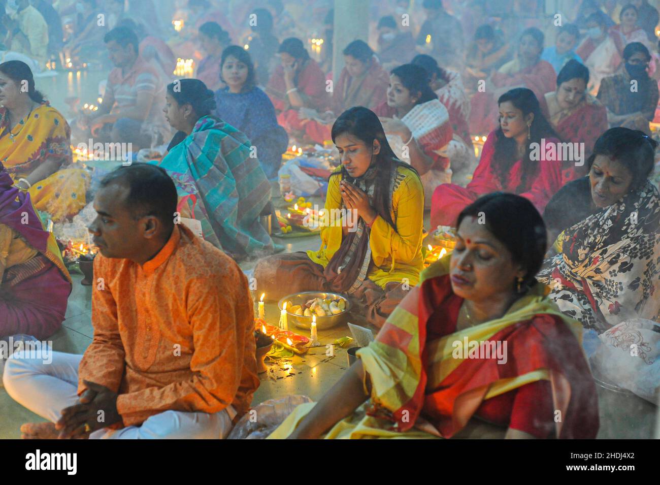 Devotees offer prayers during the ritual called Kartik Brati or Rakher ...