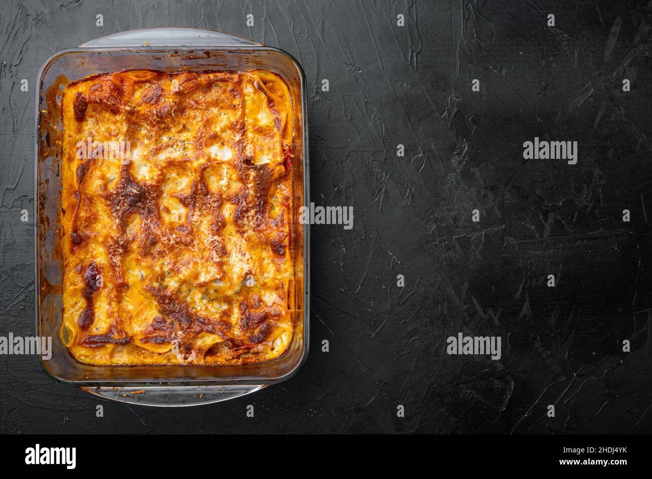 Traditional lasagna made with minced beef bolognese sauce topped with ...