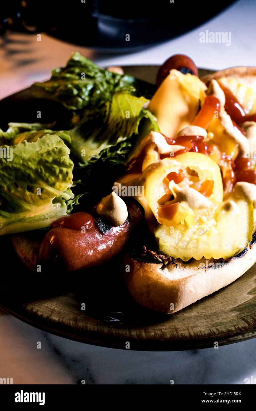 The works hot dog with retro landline corded phone in the background ...