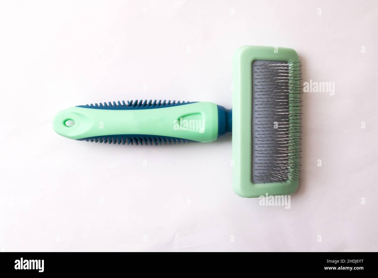 Close up green comb with hair hi-res stock photography and images - Alamy