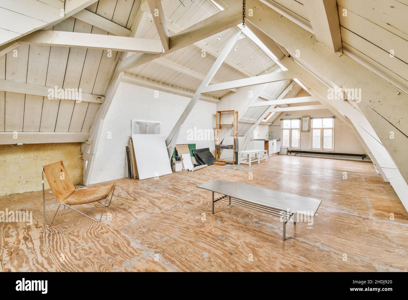 Huge loft with high ceiling and window and wooden floor Stock Photo - Alamy