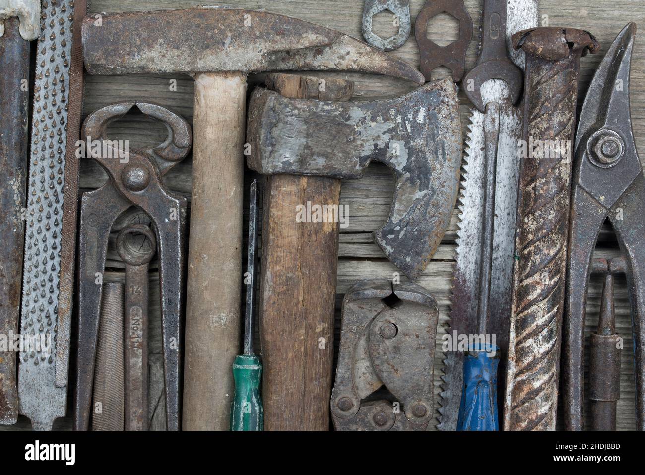 Old rusty vintage working tools on the workbench Stock Photo - Alamy