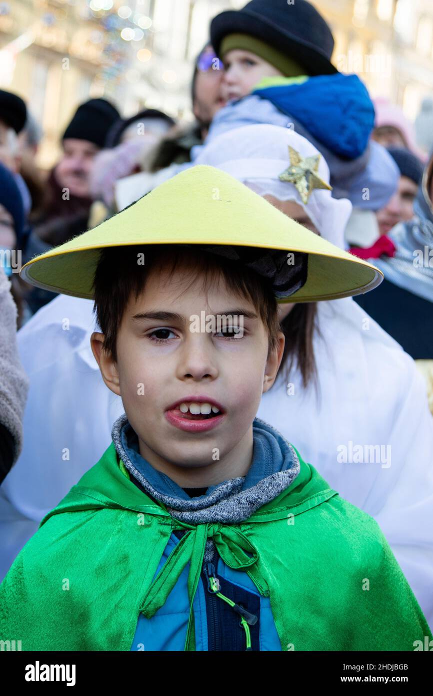 A boy wearing a headdress resembling a headdress from Asia during the ...