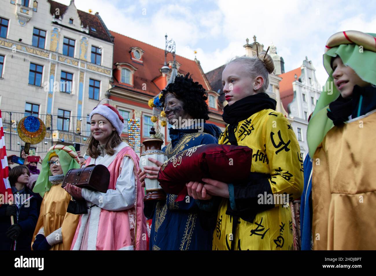 Children in costumes seen with gifts, during the Epiphany procession ...
