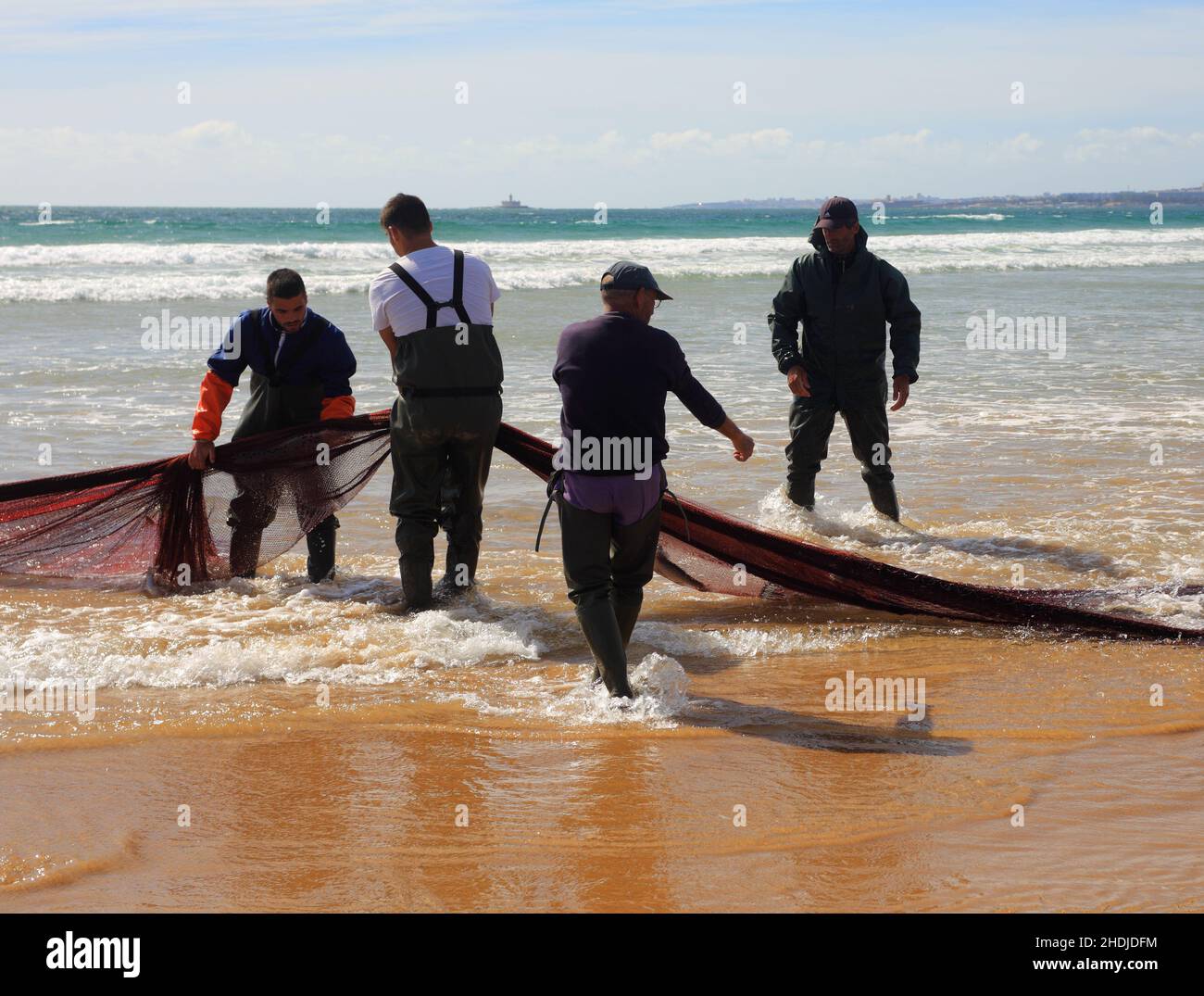 Coastal fishermen from the tiny port of Traferia, on the Tagus River ...