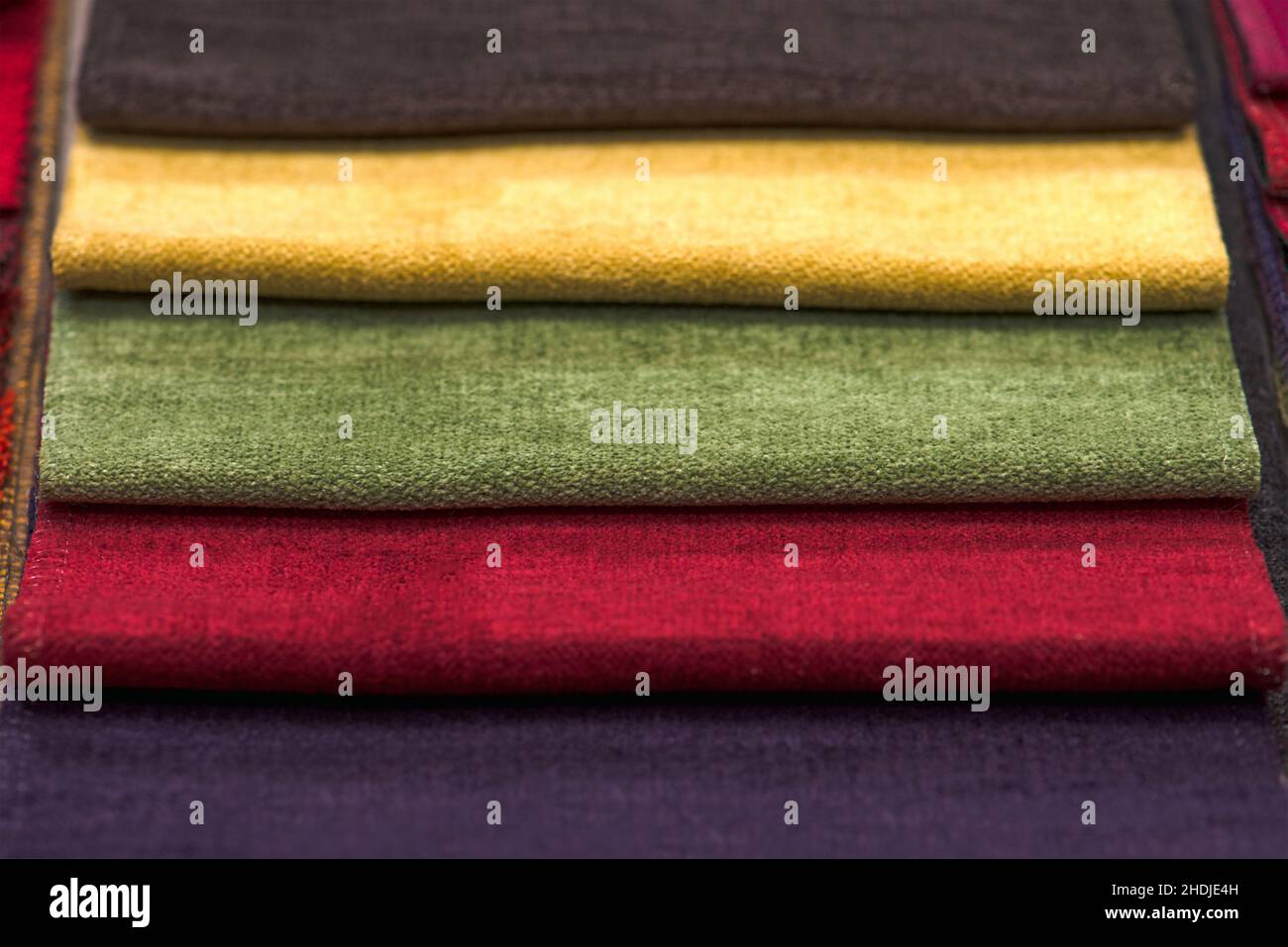Samples of textiles for upholstery. Closeup details of multicolor ...
