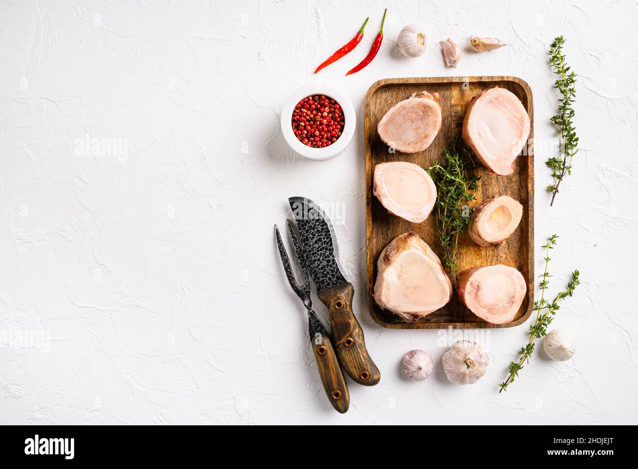 Raw caw bones butcher cut set, on white stone table background, top ...