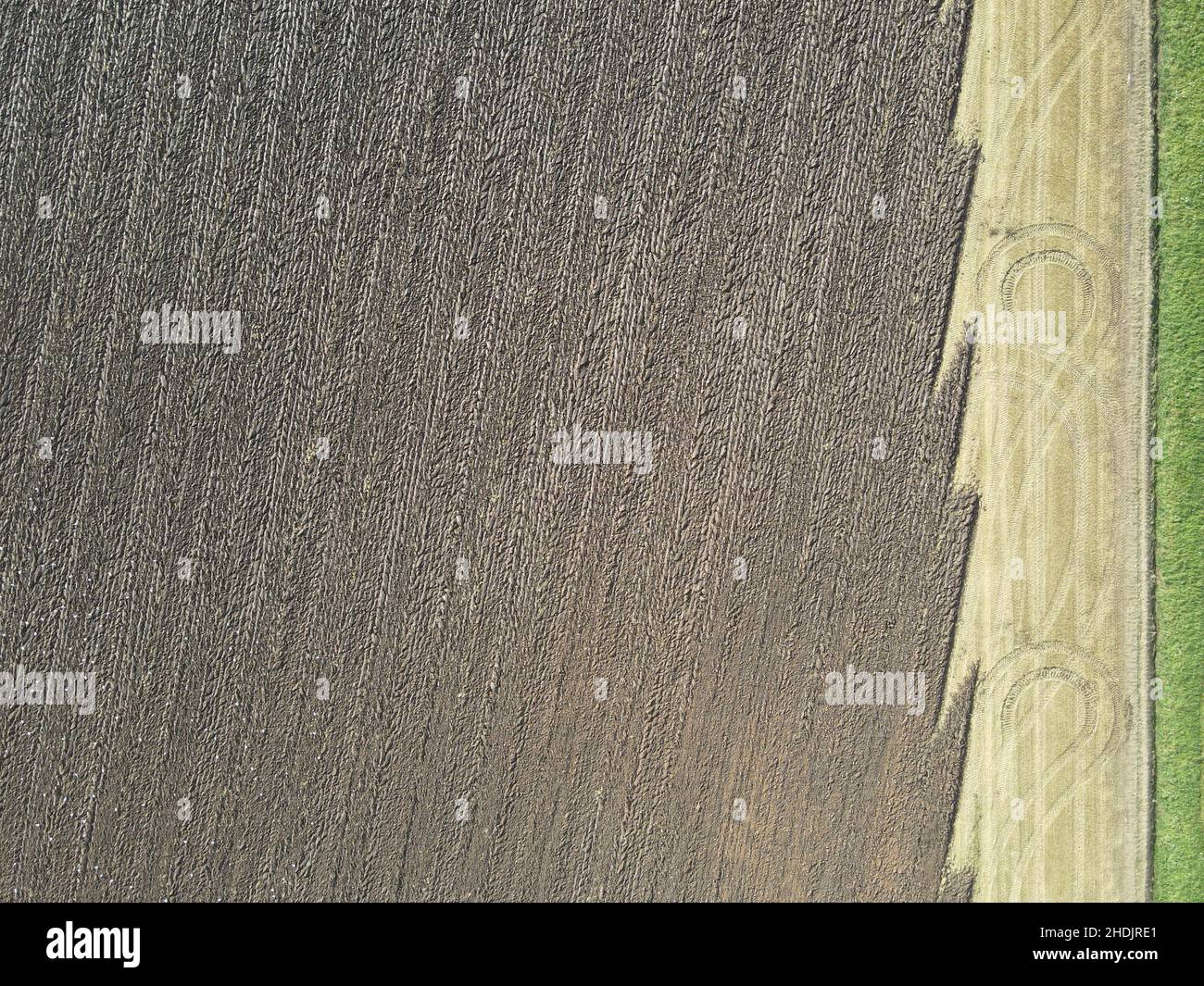 Ploughing tractor from above Stock Photo - Alamy