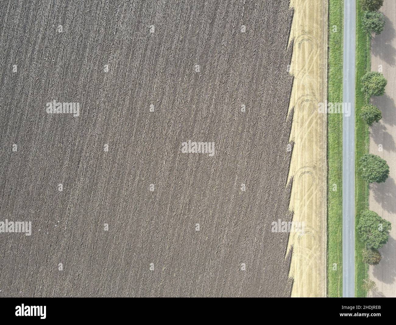 Ploughing tractor from above Stock Photo - Alamy