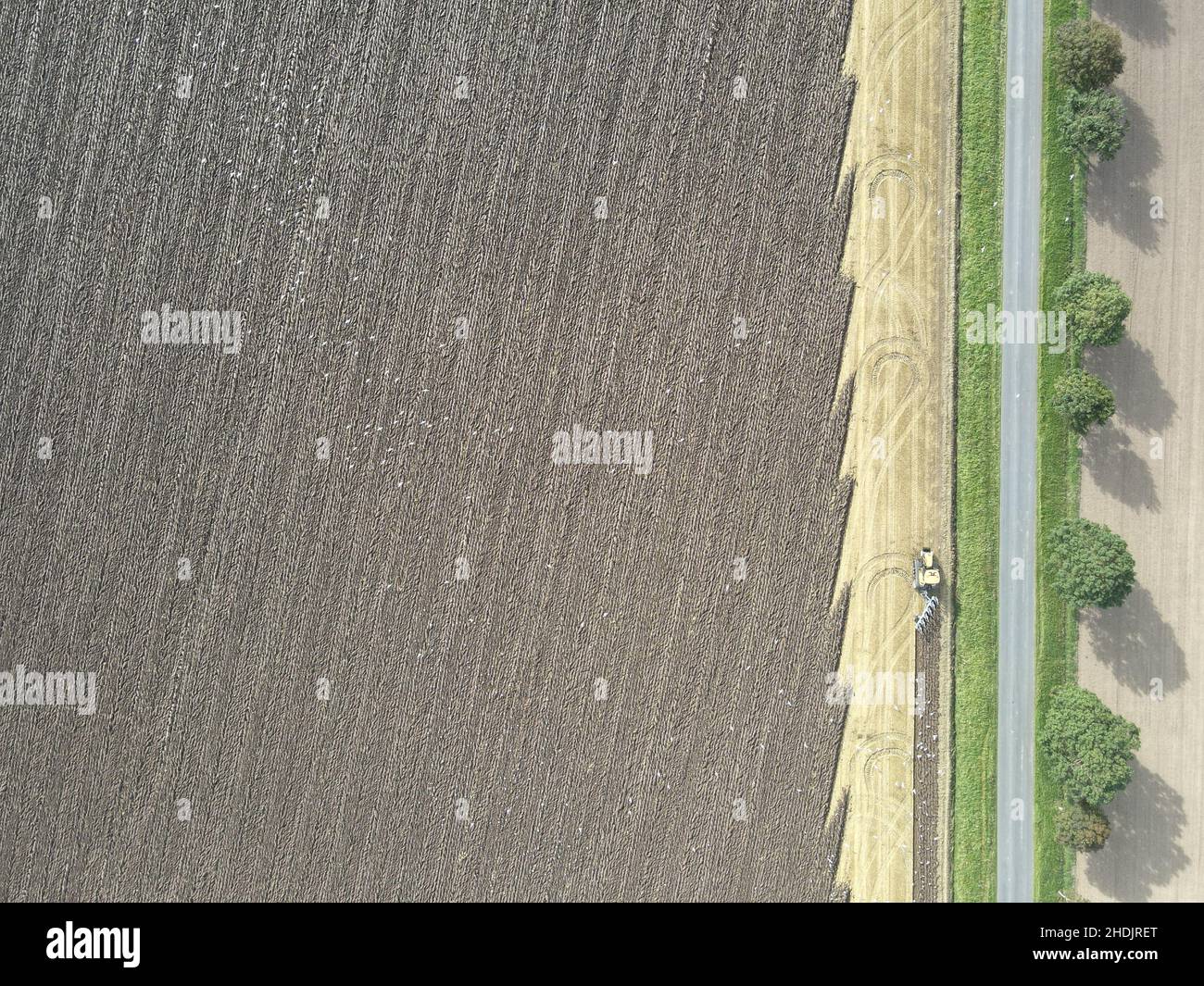 Ploughing tractor from above Stock Photo - Alamy