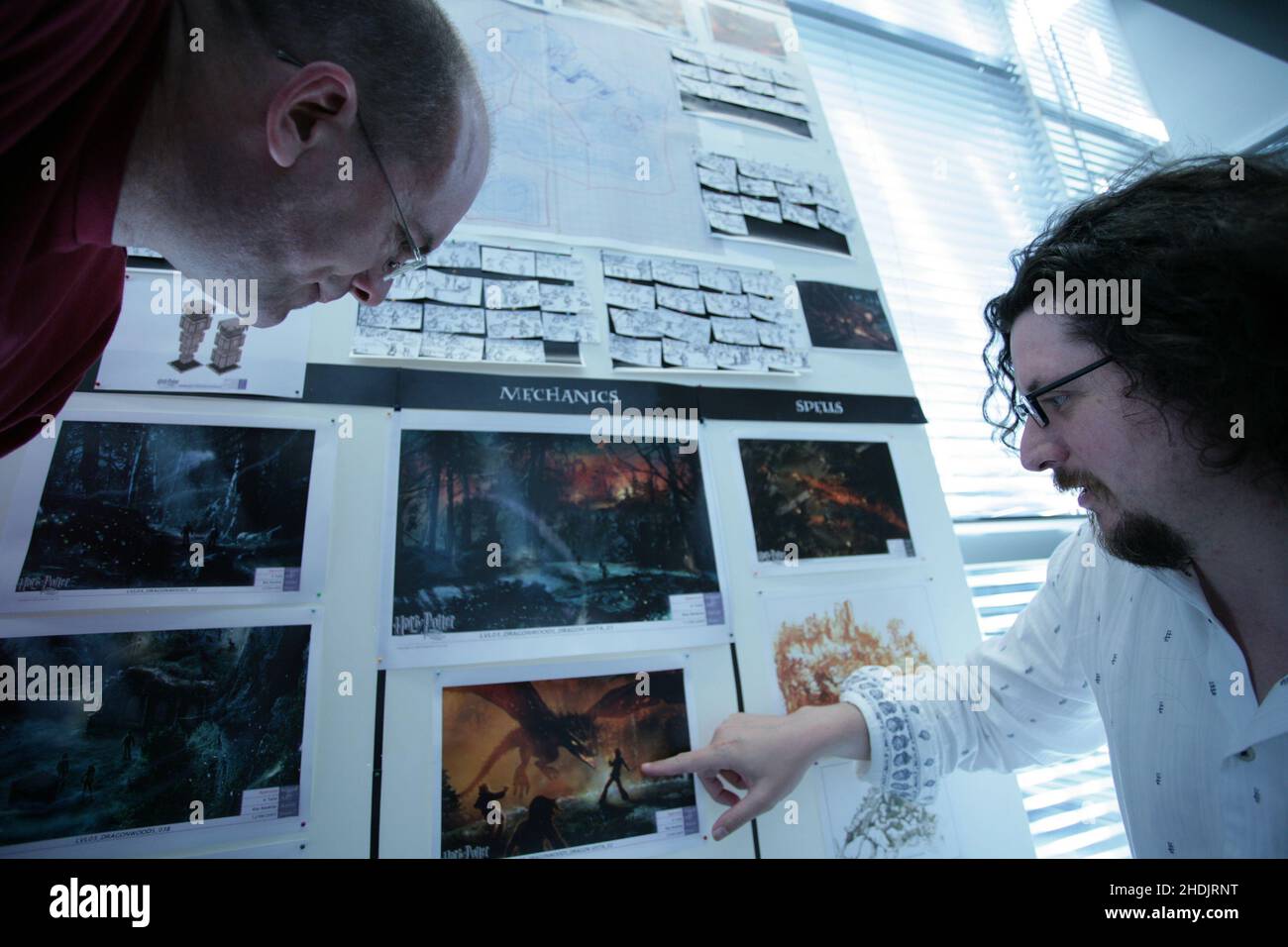 Two game developer looking at drawings.Electronic Arts developer of ...