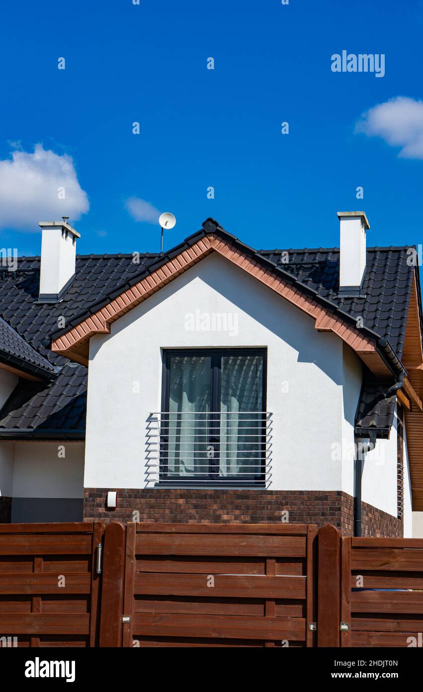 Top of a house with roof and windows Stock Photo - Alamy