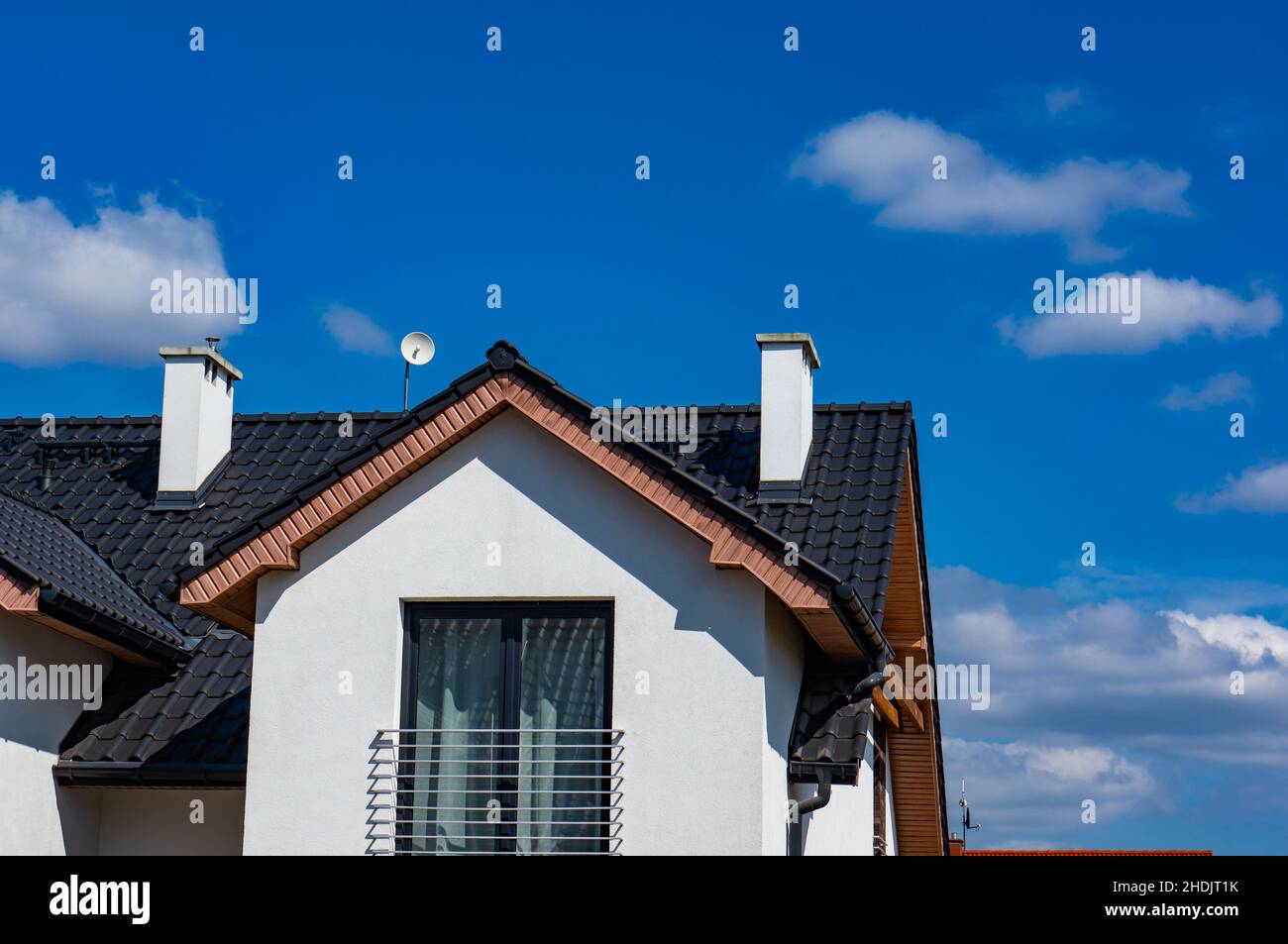 Top of a house with roof and windows Stock Photo - Alamy