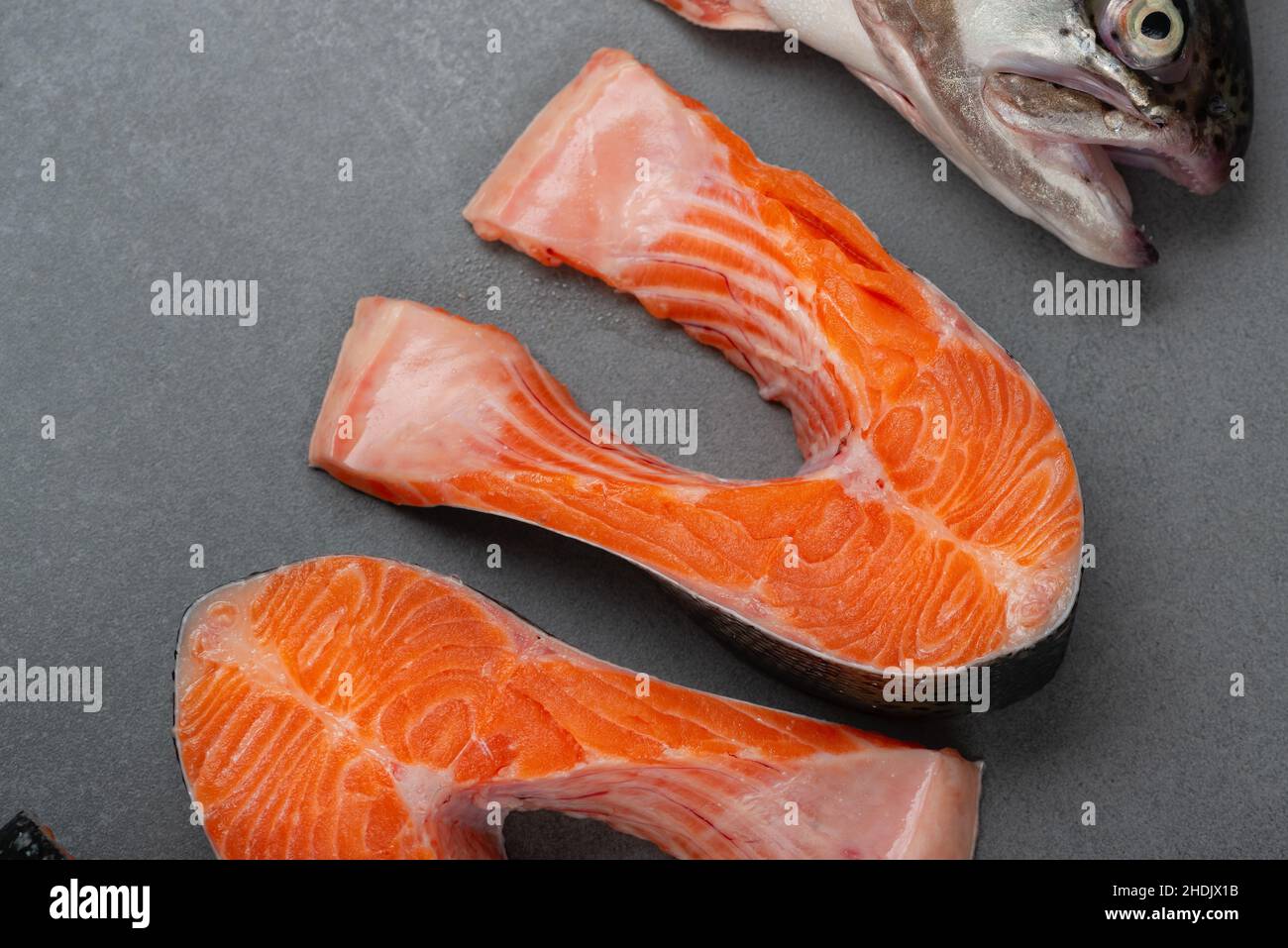 Fresh salmon fillet on the grey background Stock Photo - Alamy