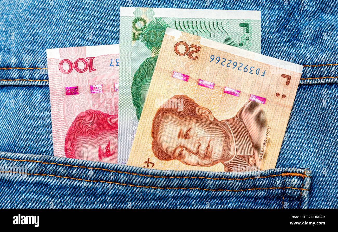 Chinese yuan banknotes sticking out of the blue jeans pocket Stock ...