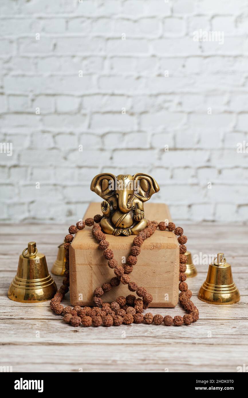 Bronze statue of Lord Ganesha, hindu God of success. Rudraksha rosary ...